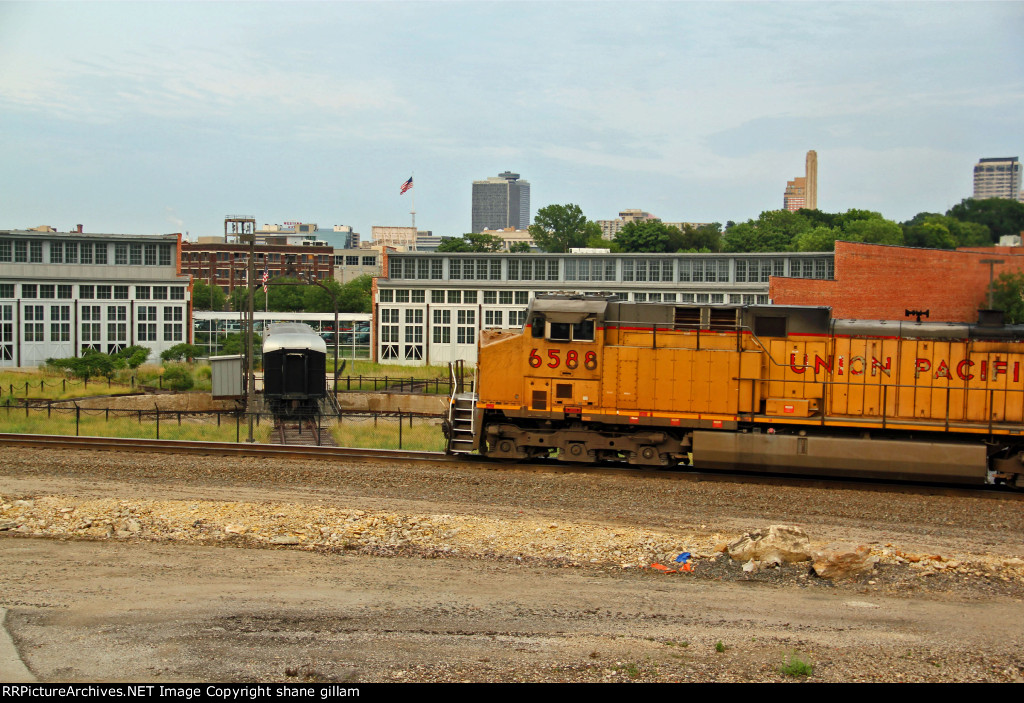 UP 6588 Dpu passing a Ex Kcs passenger car.